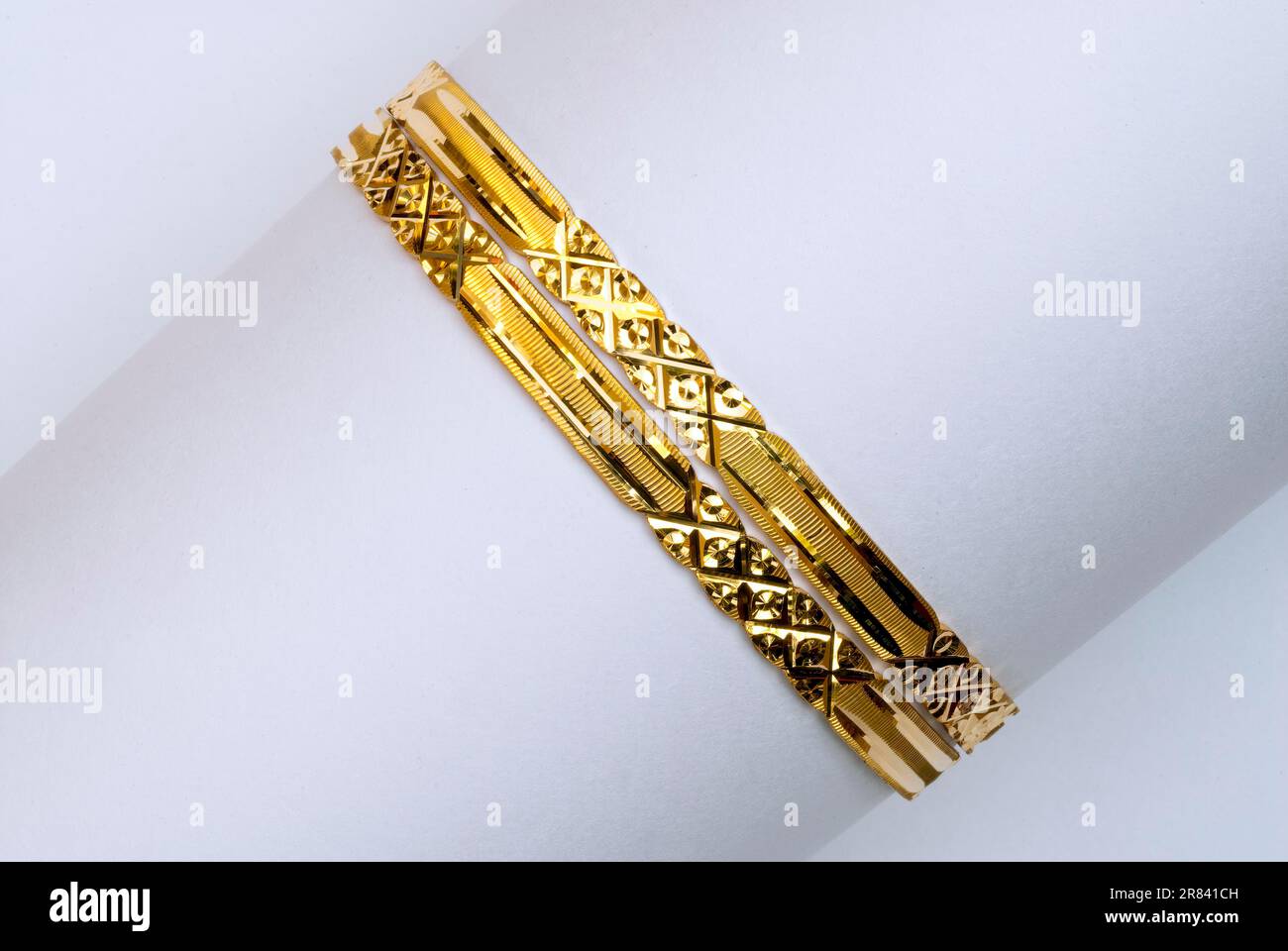 Gold bangles, women wear on the arm or wrist called bangle on white ...