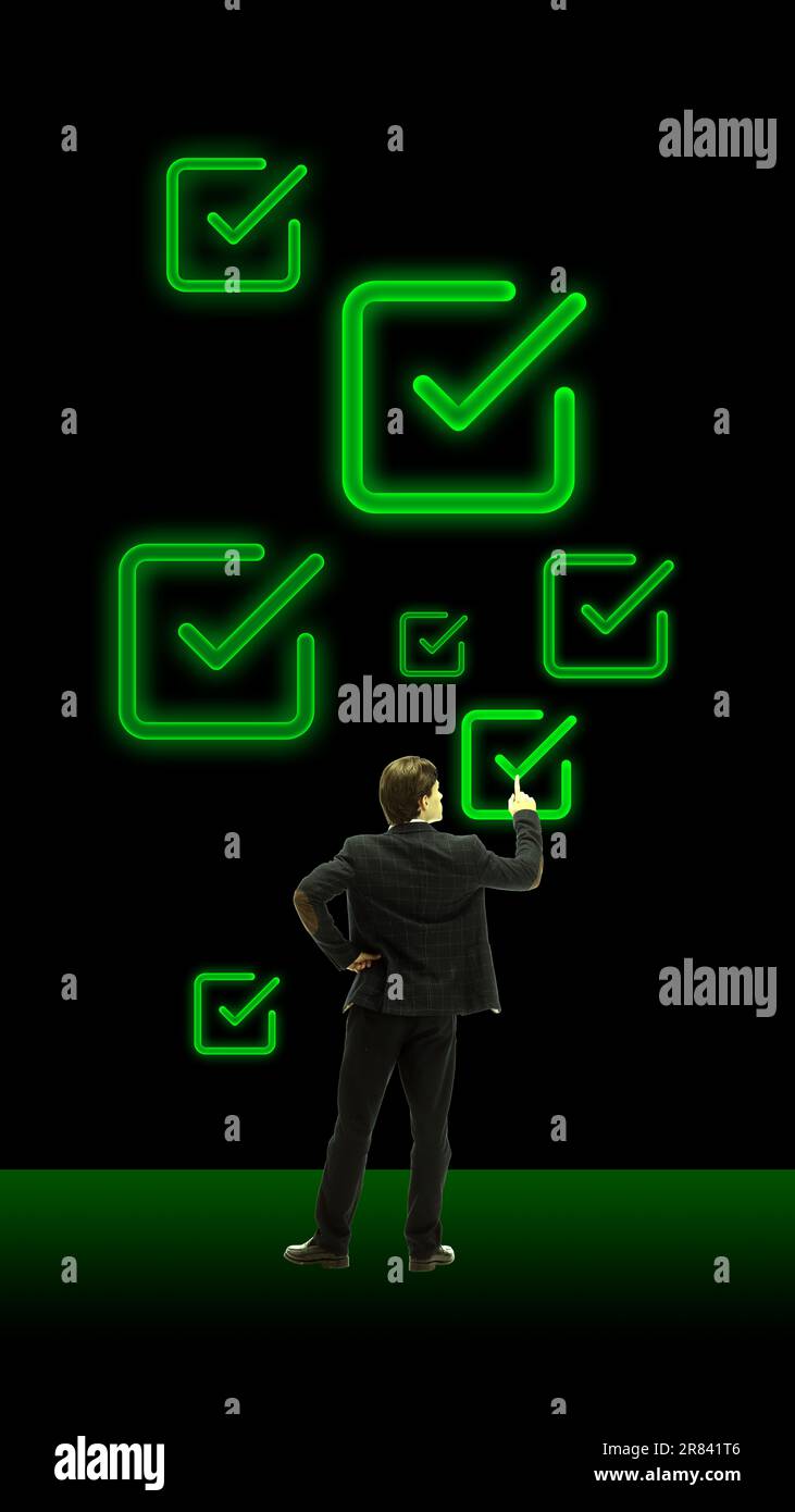 Businessman, office worker looking at check marks, finishing ...