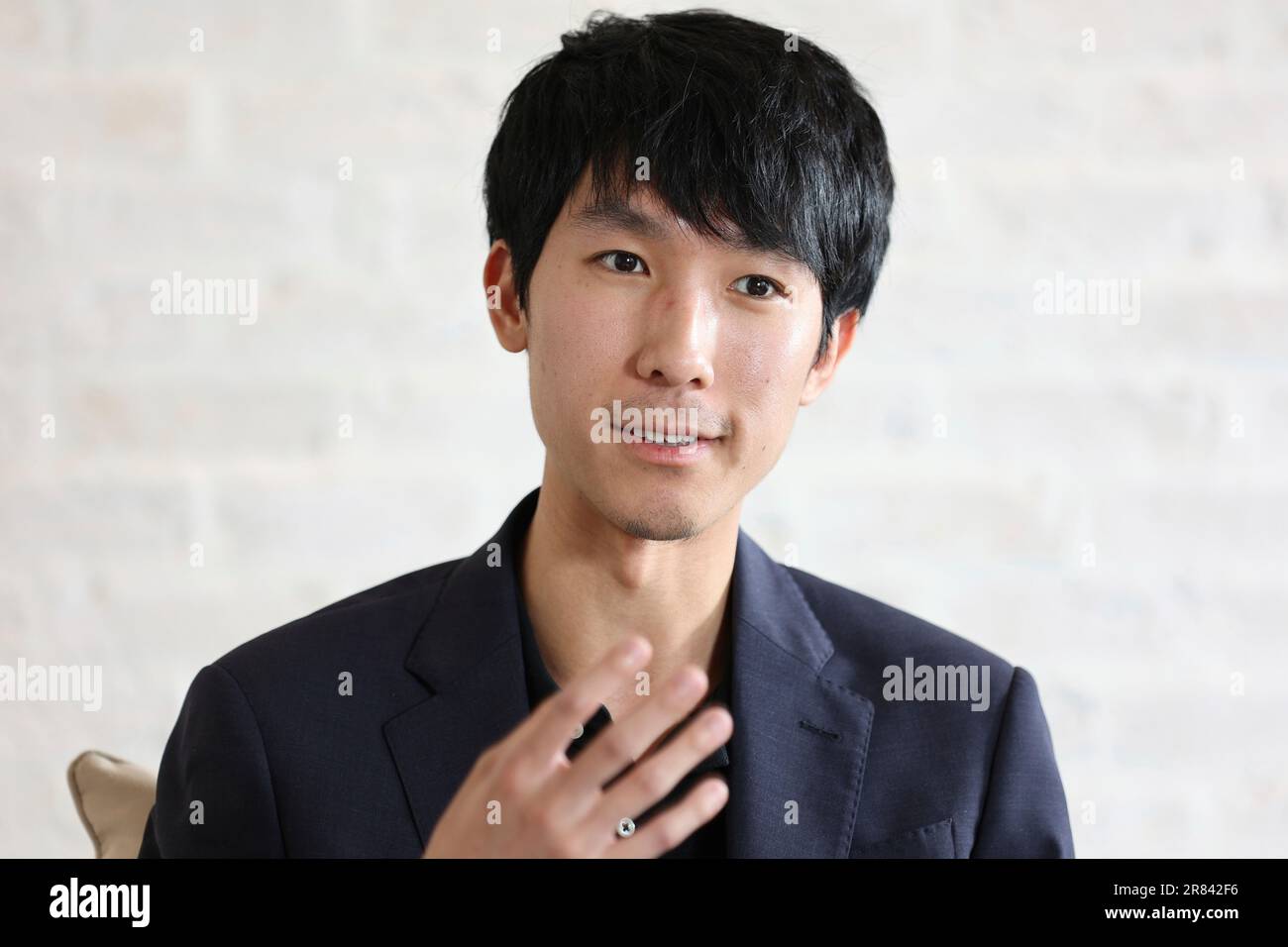 Eric Lu , an American pianist ,speaks during an interview by the ...