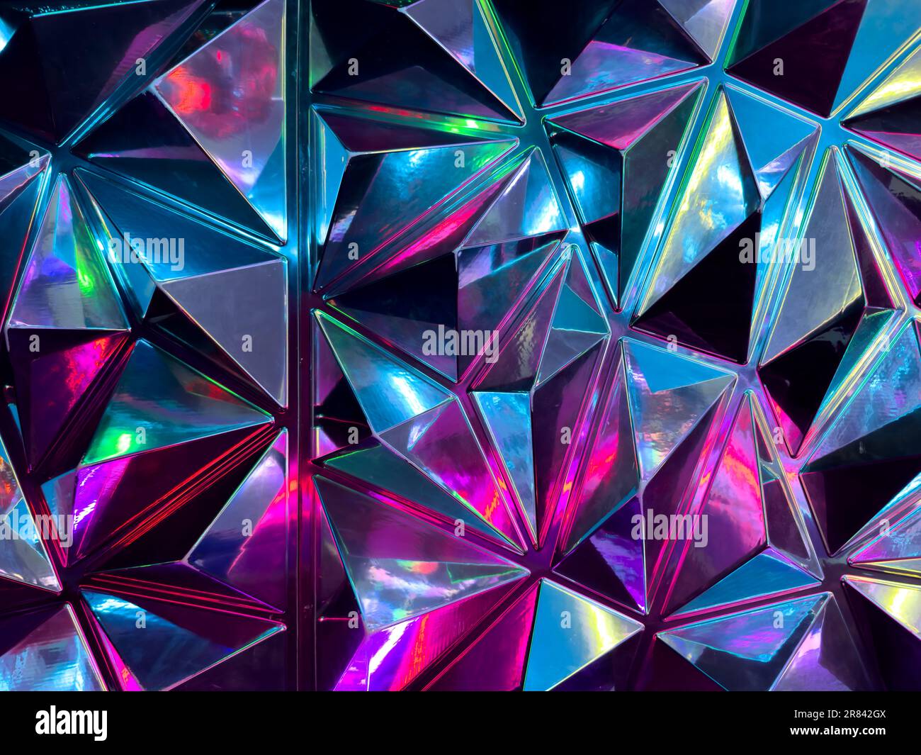 A colorful glass texture with various shapes and hues, shining brightly ...