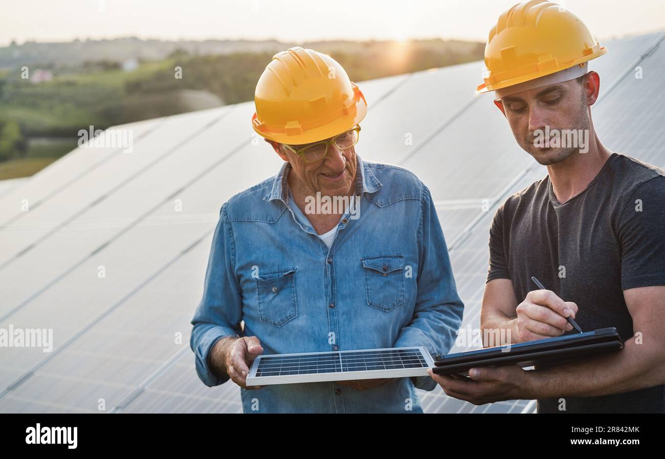 Engineers working at solar panels factory outdoor - Photovoltaic ...