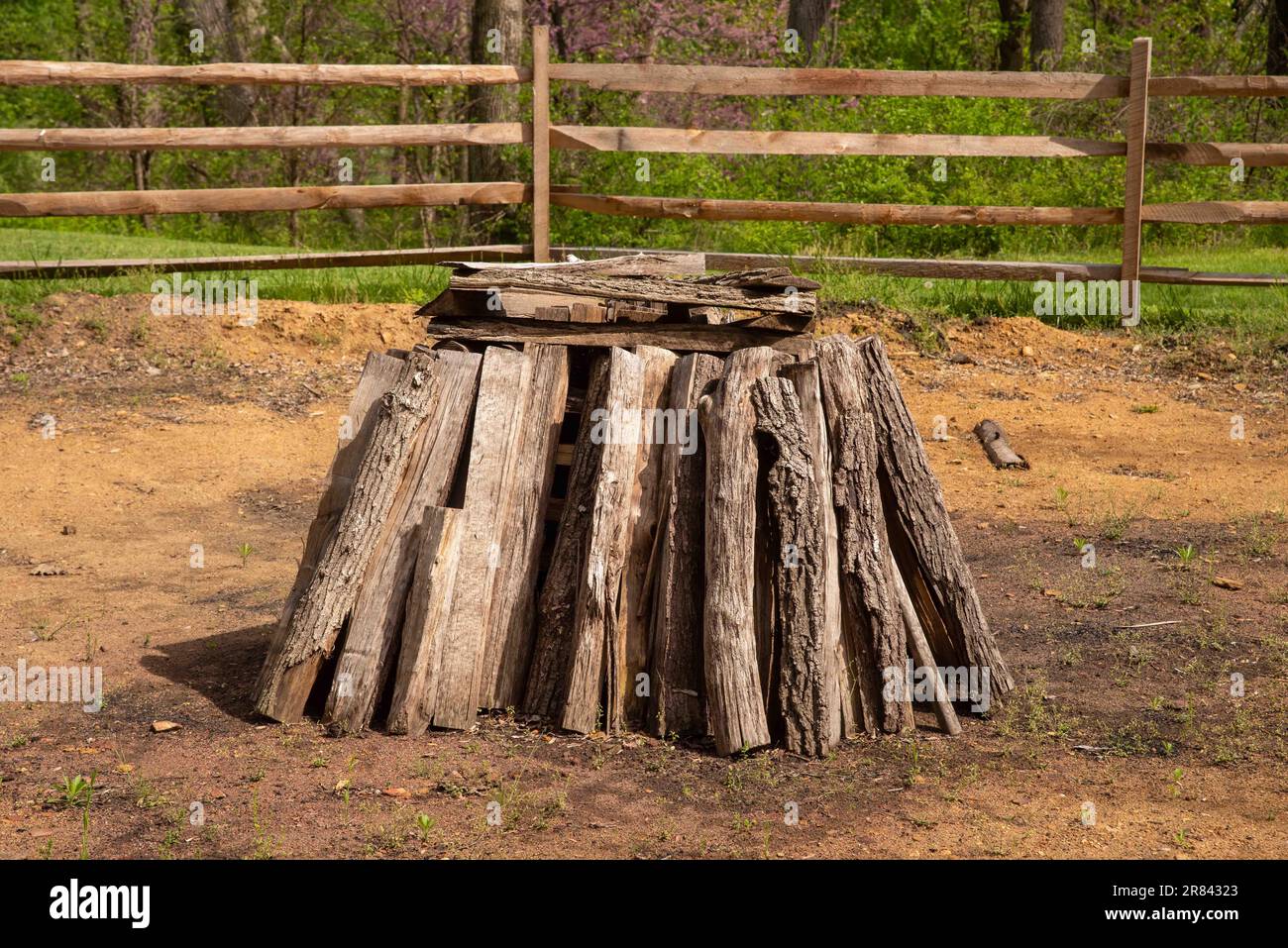 Split logs firewood form a circular stack for a bonfire Stock Photo - Alamy