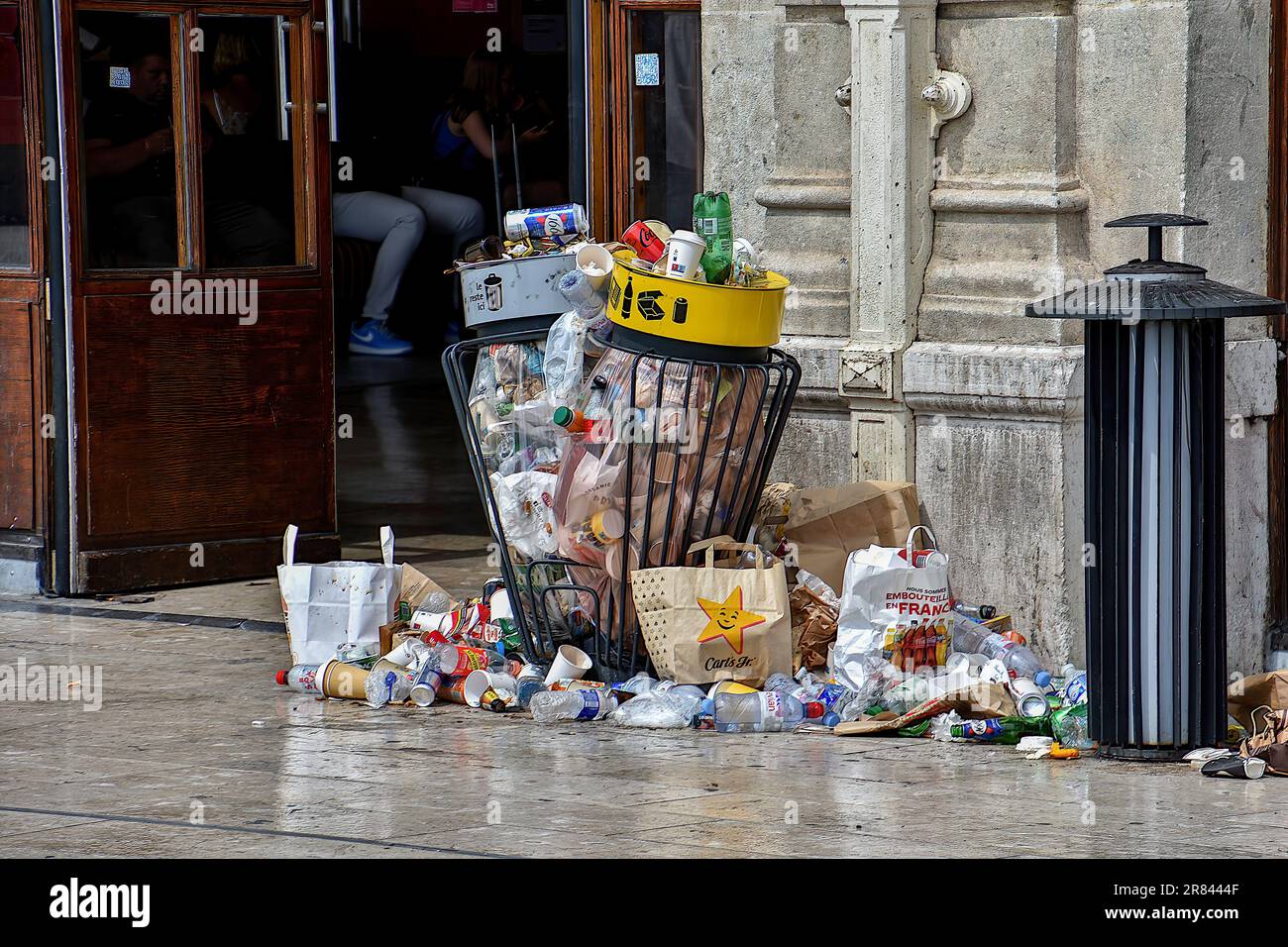 Waste that overflows from bins to litter the ground is seen at Saint ...