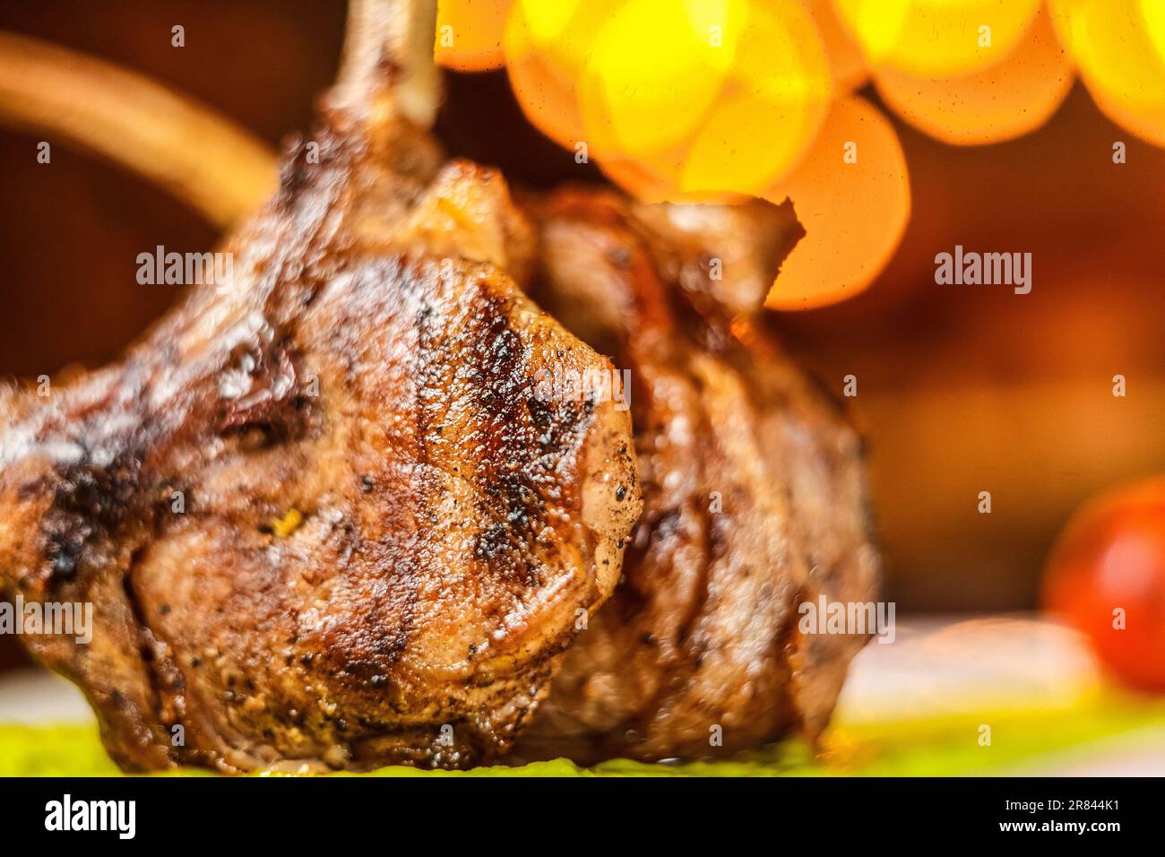 A large roast of succulent meat, crisped to perfection and surrounded ...