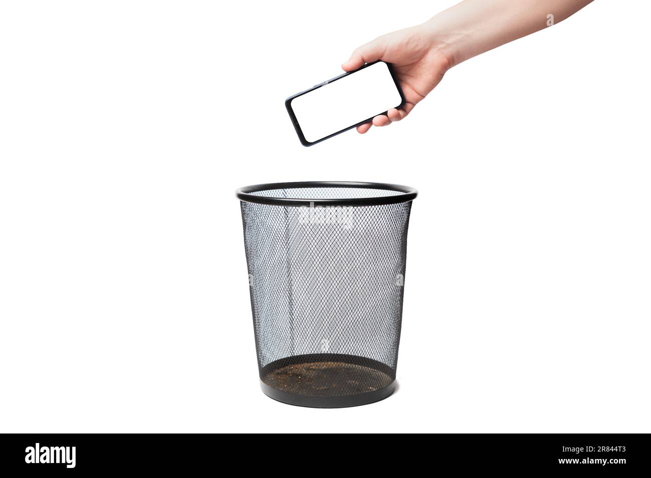 Man dump a blank screen smartphone in a trash bin Stock Photo - Alamy