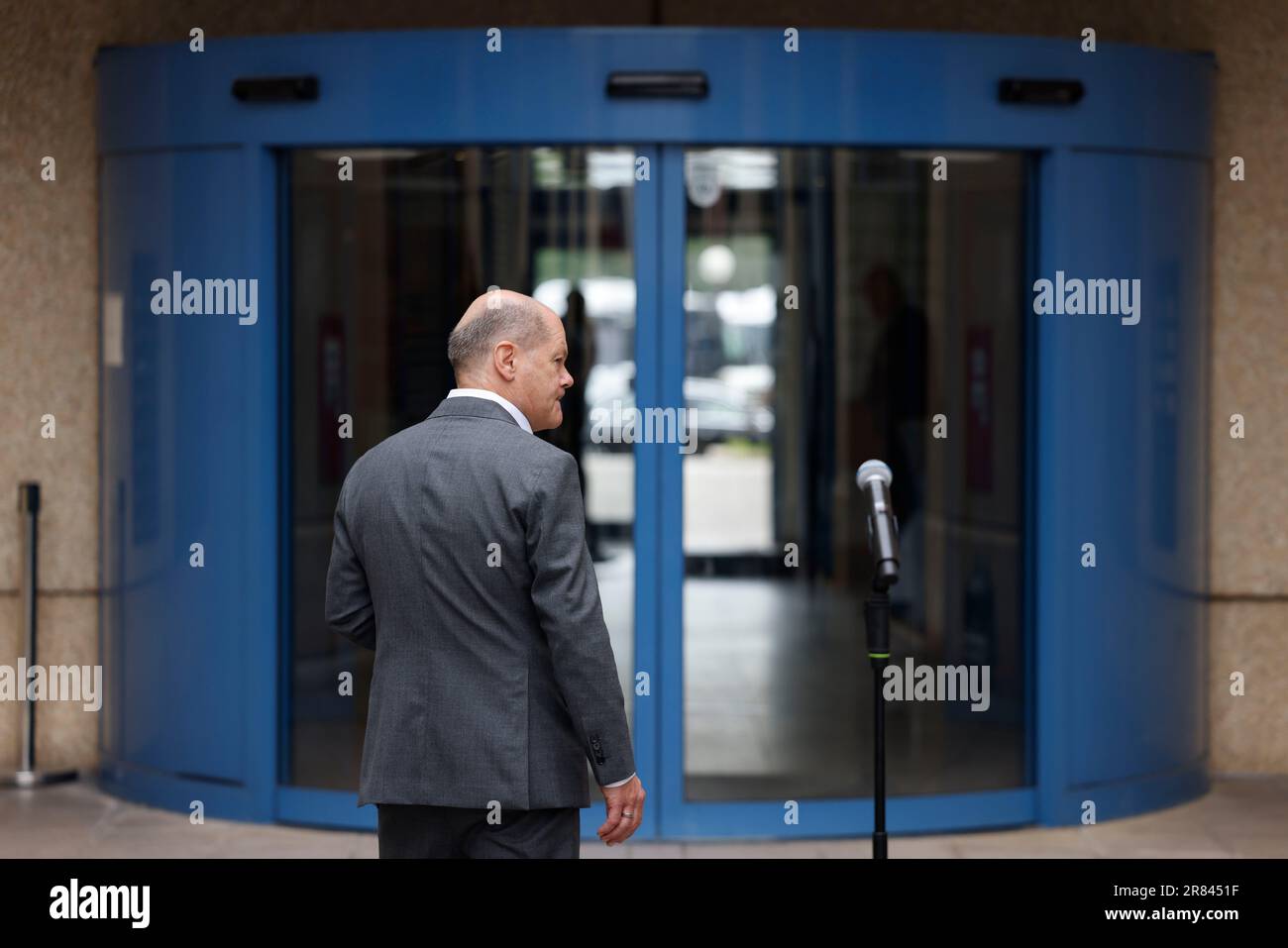 German Chancellor Olaf Scholz leaves after a press conference, as he ... German Chancellor Olaf Scholz leaves after a press conference, as he ...