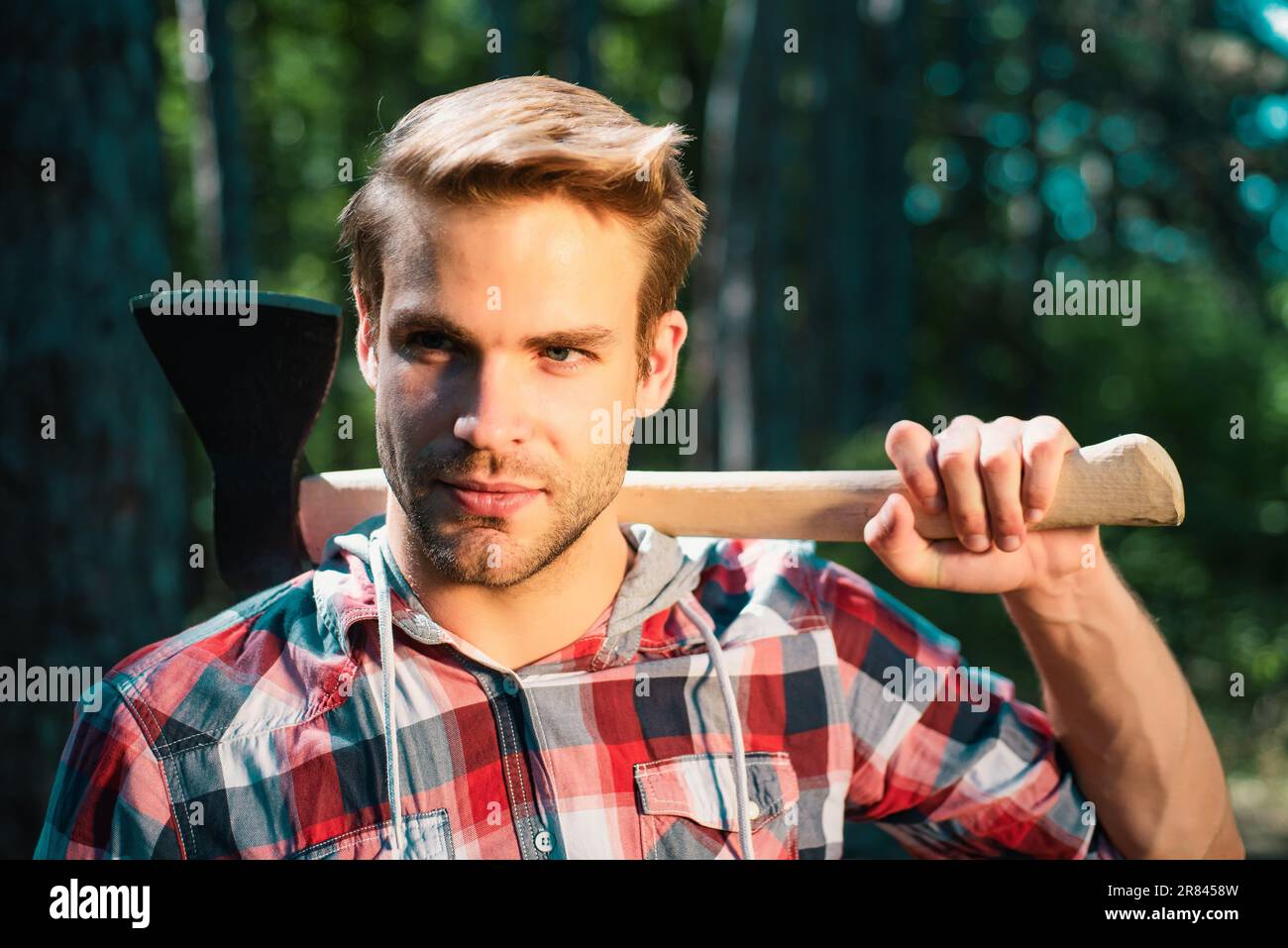 Hipster holding axe on shoulder hi-res stock photography and images - Alamy
