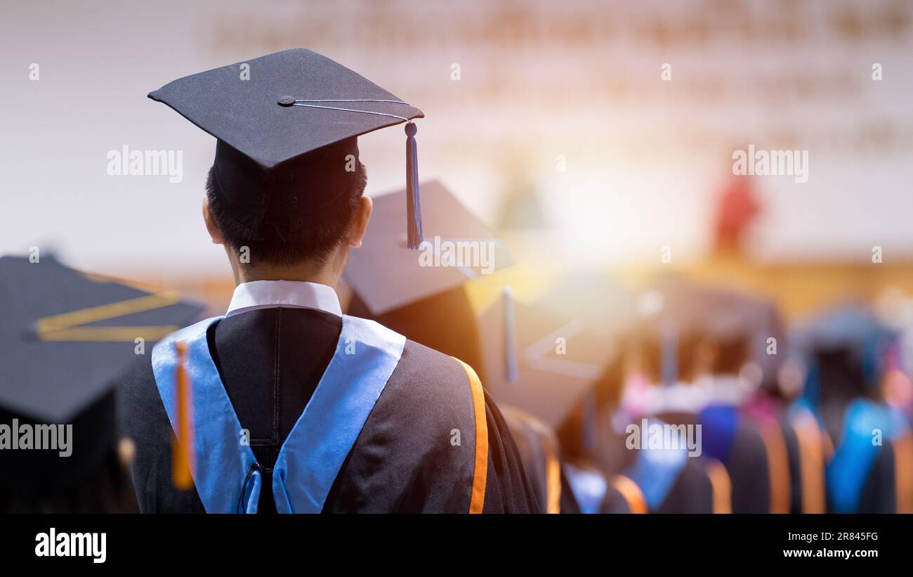 A graduate wearing the cap and gown during the ceremony Stock Photo - Alamy
