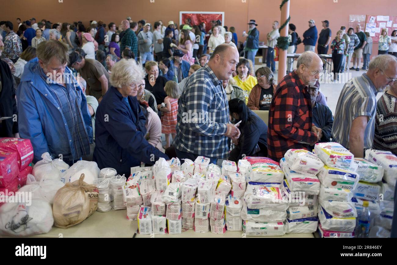 Volunteers line up carts of food for the needy in Morganton NC Stock ...