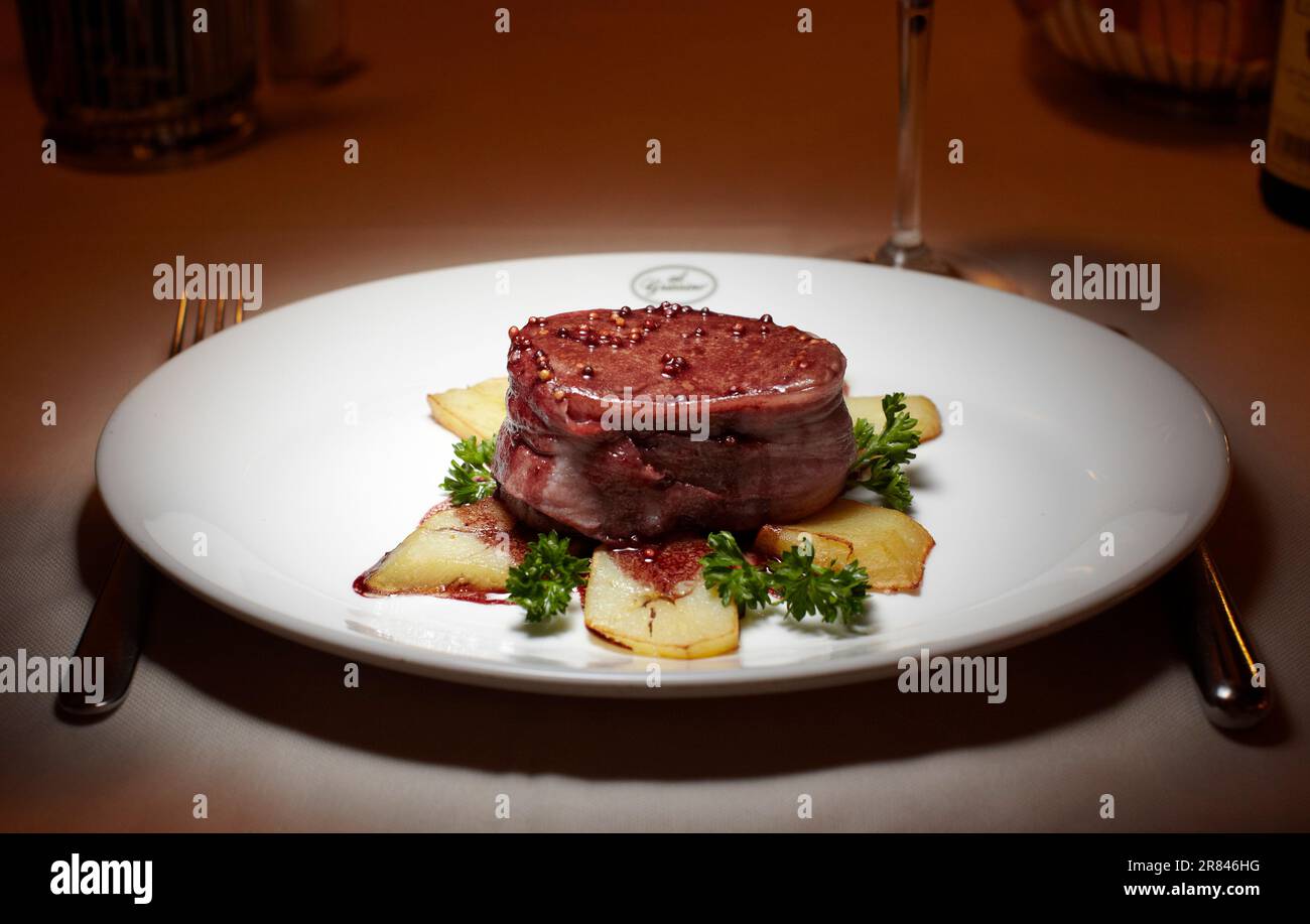 Braised tuna topped with barolo wine at a Milan seafood restaurant ...