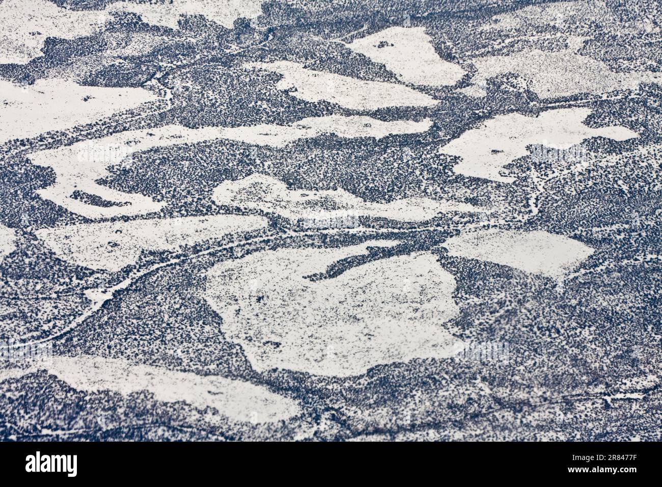 Aerial view of fresh snowfall highlights roads and fields cleared from ...