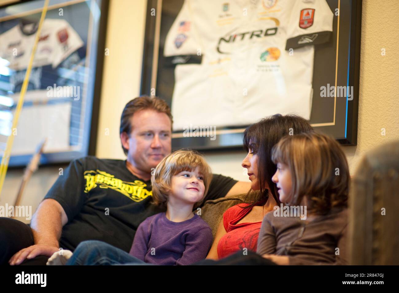 Professional angler with his wife and daughters at home Stock Photo - Alamy
