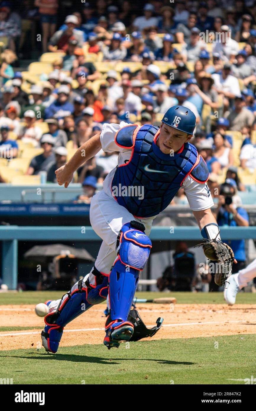 Los Angeles Dodgers catcher Will Smith (16) tracks down an errant throw ...