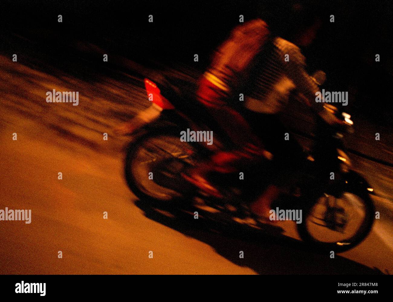 Two people speed down the street in their motorcycle in Hanoi, Vi Stock ...