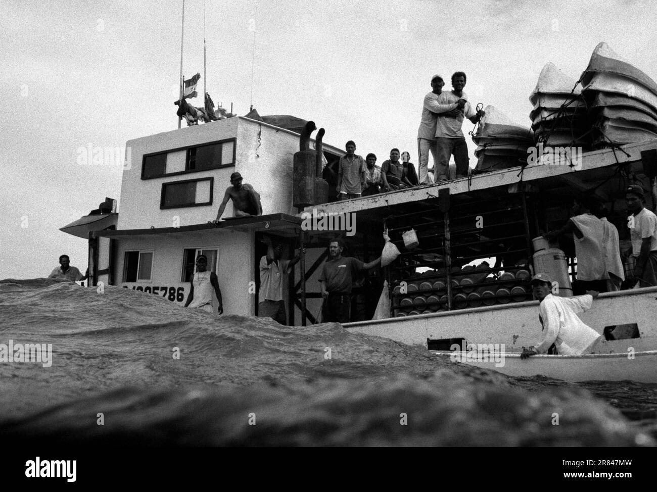 A boat of Lobster divers doing their days work, Miskito Coast, Honduras ...