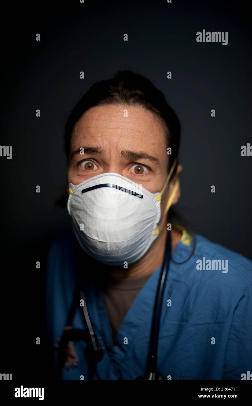Studio portrait of 42 year old caucasian female registered nurse ...