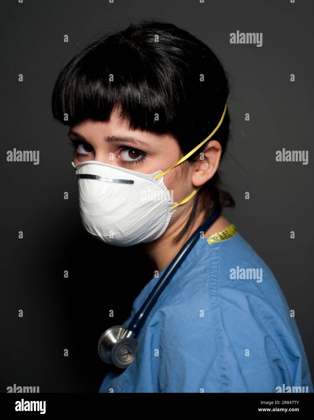 Studio portrait of 25 year old caucasian female wearing a N95 mask and a stethoscope Stock Photo ...