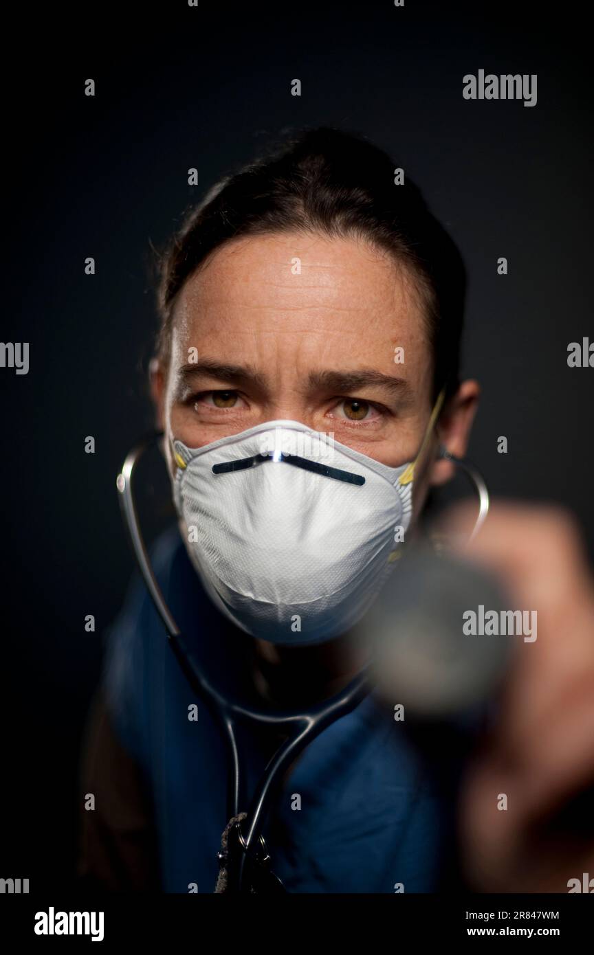 Studio portrait of 42 year old caucasian female registered nurse ...