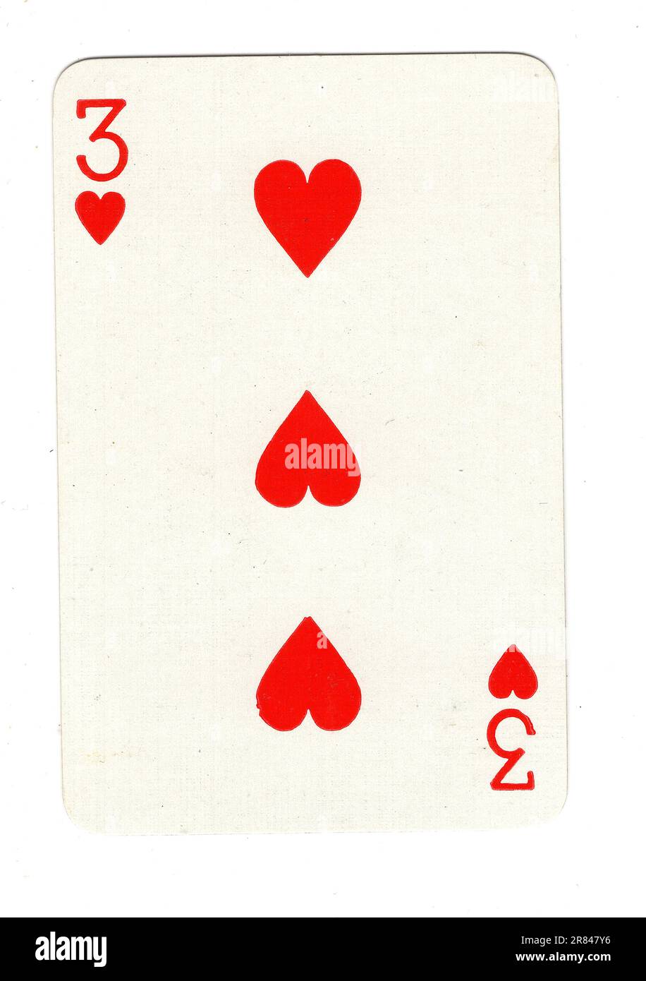 A three of hearts vintage playing card on a white background Stock ...