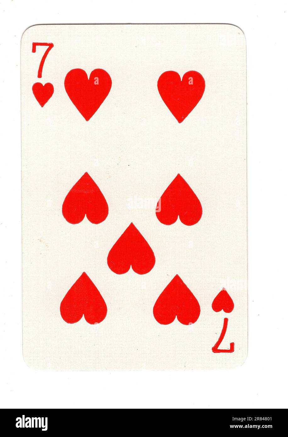 A seven of hearts vintage playing card on a white background Stock Photo - Alamy