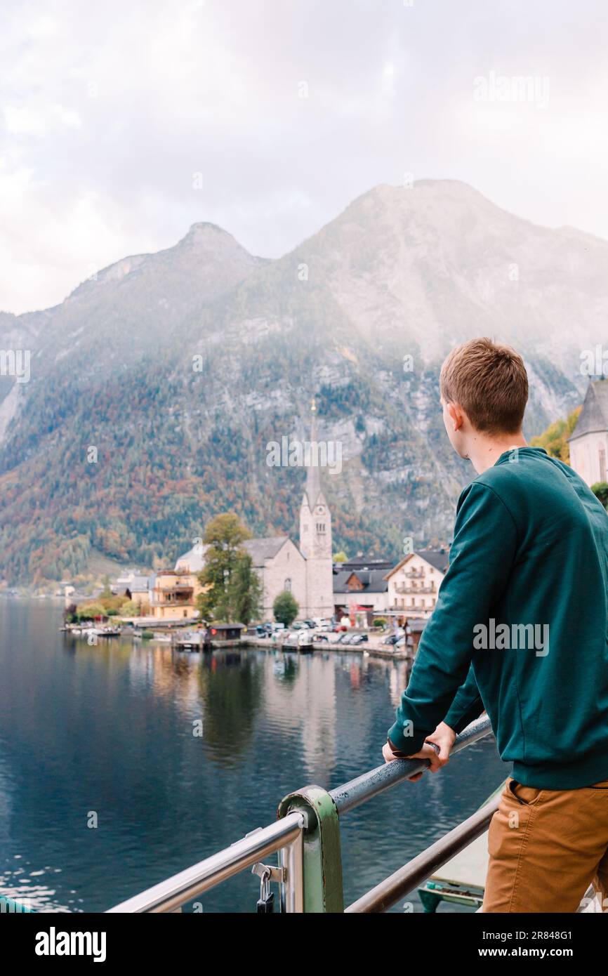 tourist enjoys a view of Lake Hallstatt, Austria Stock Photo - Alamy