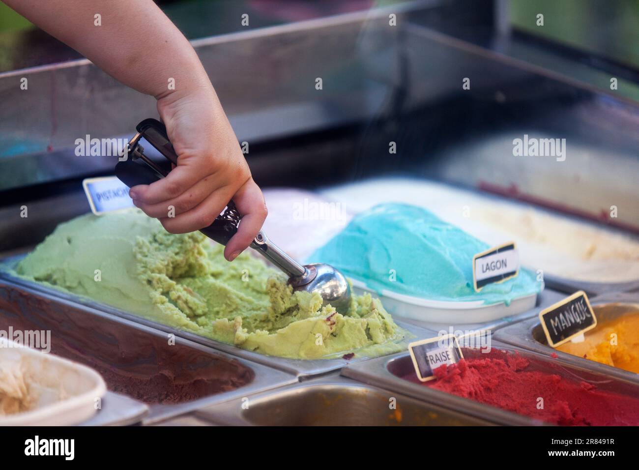 close up of scooping ice cream in gelato cafe Stock Photo - Alamy