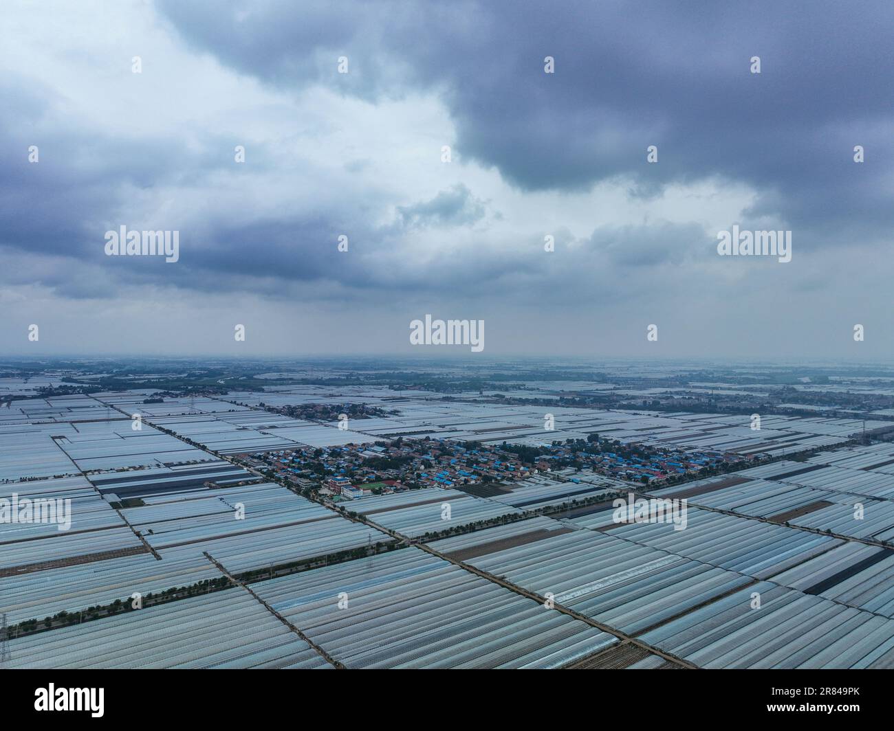 Aerial photo taken on June 19, 2023 shows agricultural greenhouses in ...