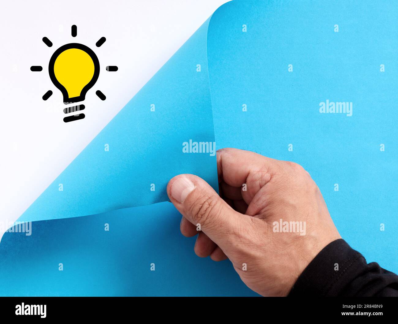 To find a creative idea or a new invention concept. Male hand opens the ...