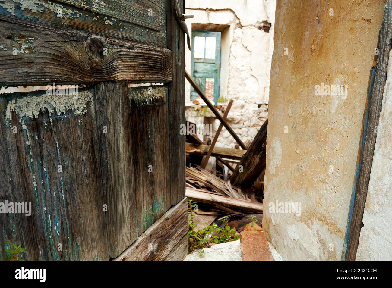 Old destroyed wooden house after explosion in a war and catastrophe ...