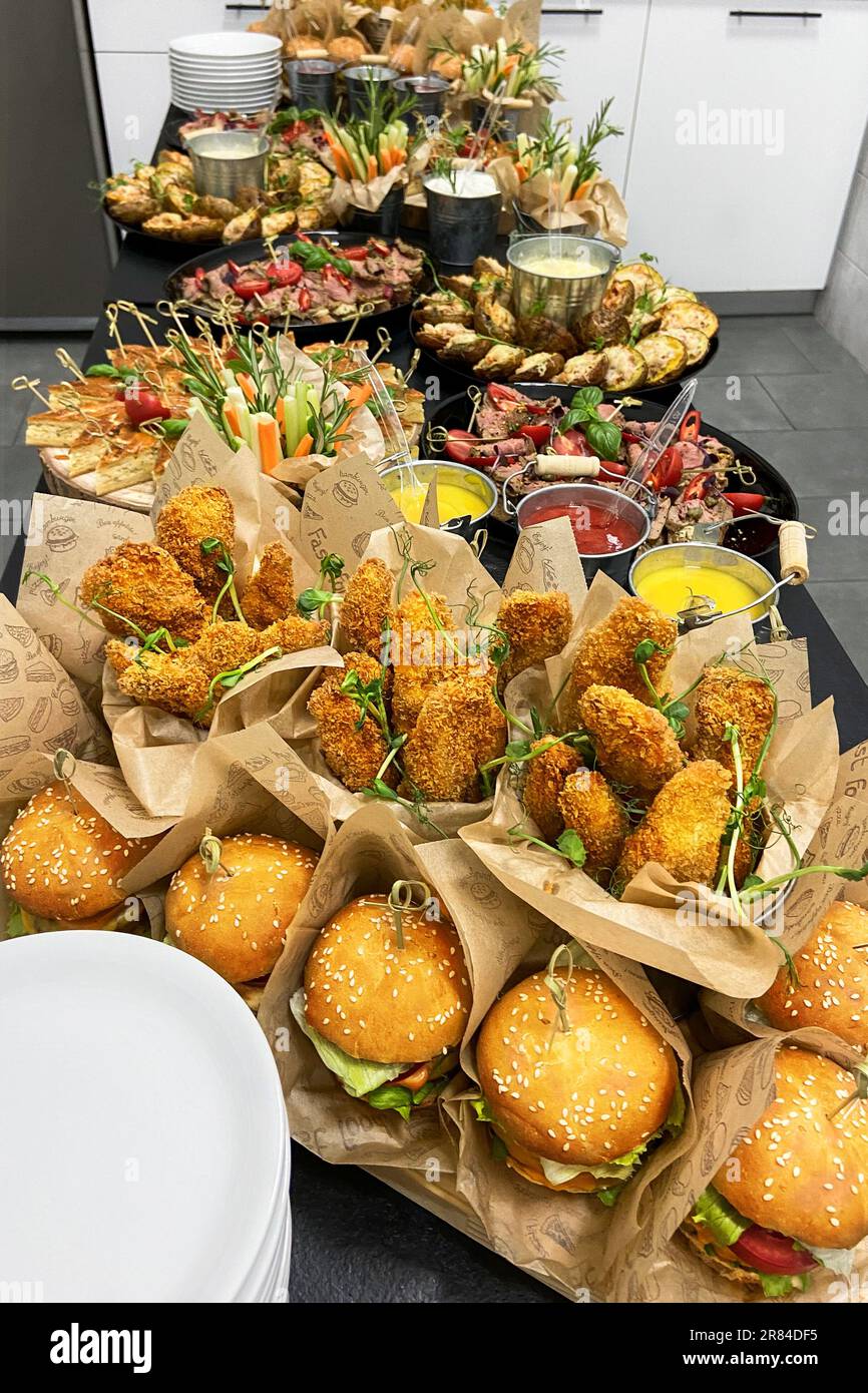 Сatering with variety fast food. Burgers, nuggets, potatoes, sauces and ...