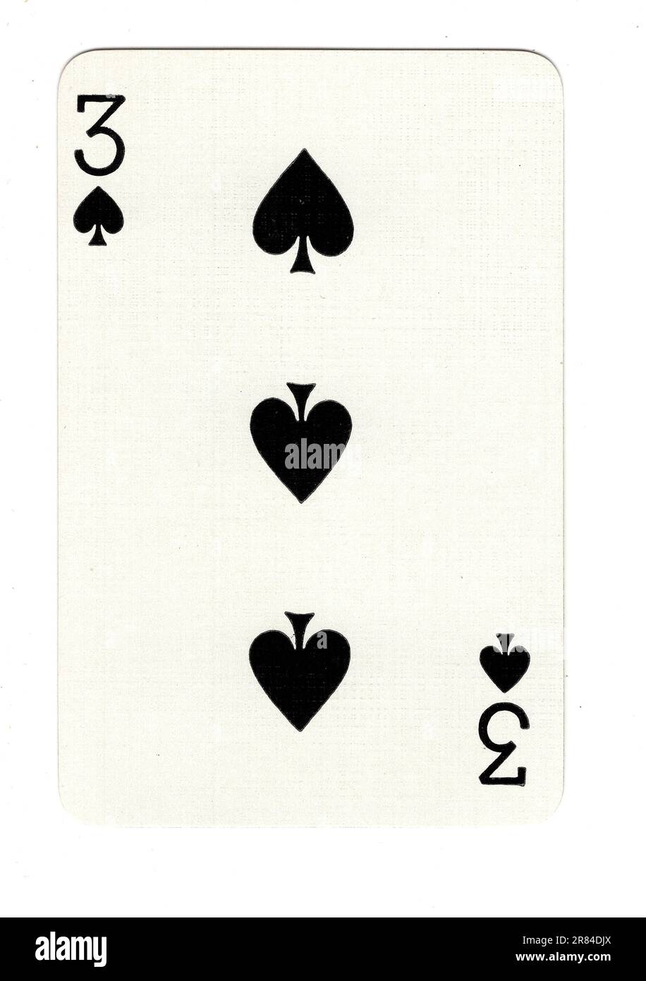 A three of spades vintage playing card on a white background Stock ...
