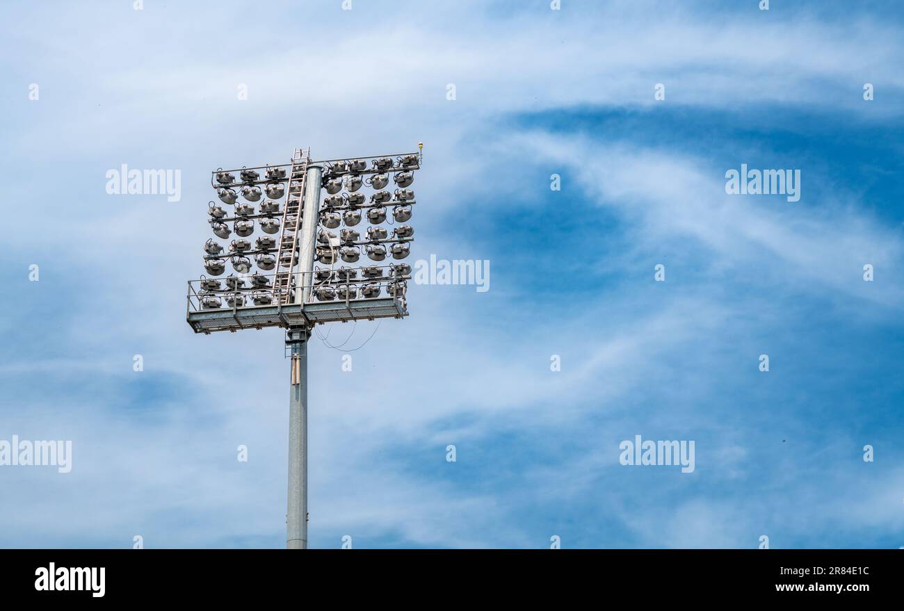 Stadium lighting system on background of blue sky Stock Photo - Alamy