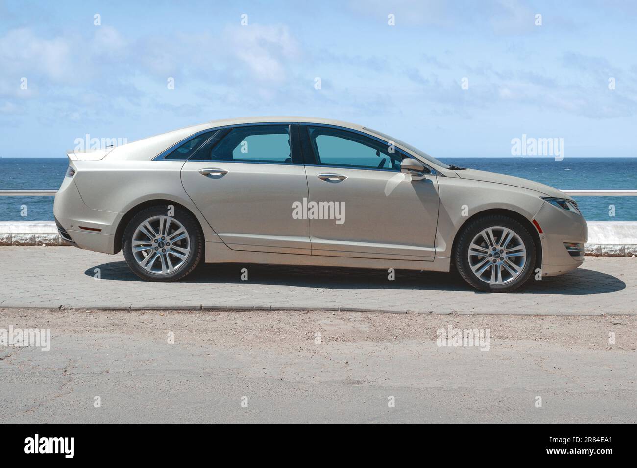 2016 Lincoln MKZ 2.0H (Second generation) parked next to sea Stock ...