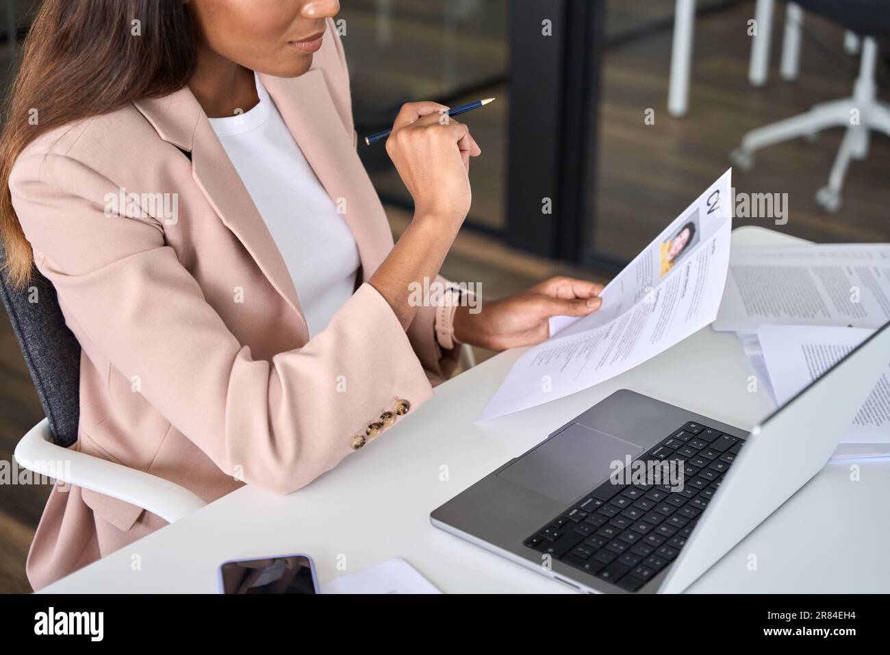 Close up view of female HR manager reading cv during virtual job ...