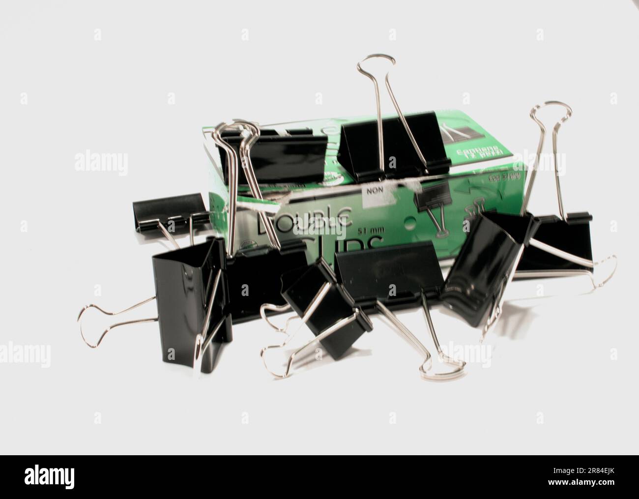 A stack of shiny metal binders against a white background Stock Photo ...