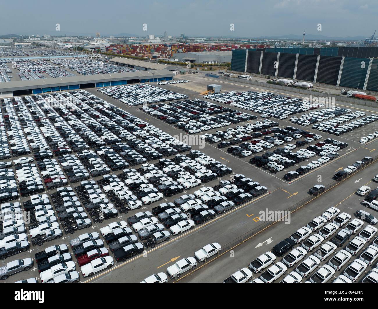 Aerial view of new cars stock at factory parking lot. Above view cars ...