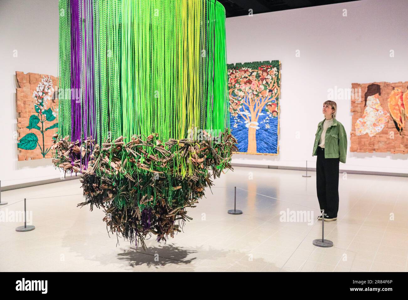London, UK. 19th June, 2023. Gallery staff with Andrea Bowers ...