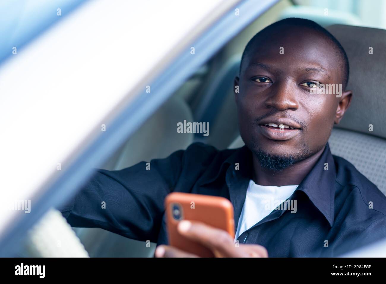 African man driving hi-res stock photography and images - Alamy