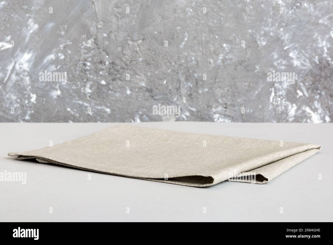 top view with gray kitchen napkin isolated on table background. Folded ...