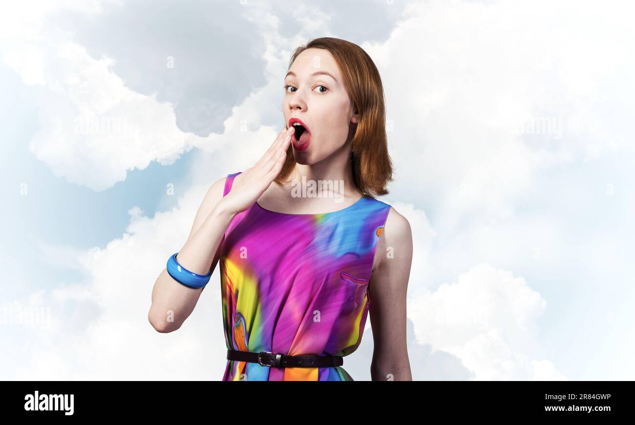 Surprised young female model with red hair Stock Photo - Alamy