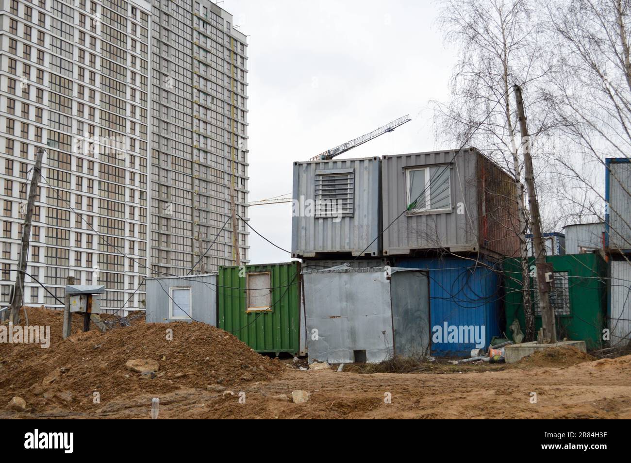 Small temporary houses of builders from containers at an industrial ...
