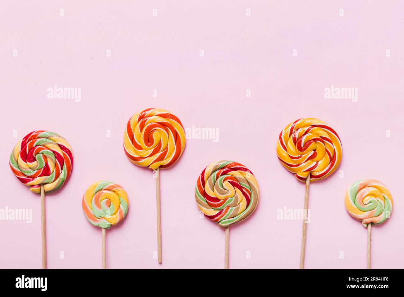 Set of colorful lollipops on colored background. Summer concept. Party ...