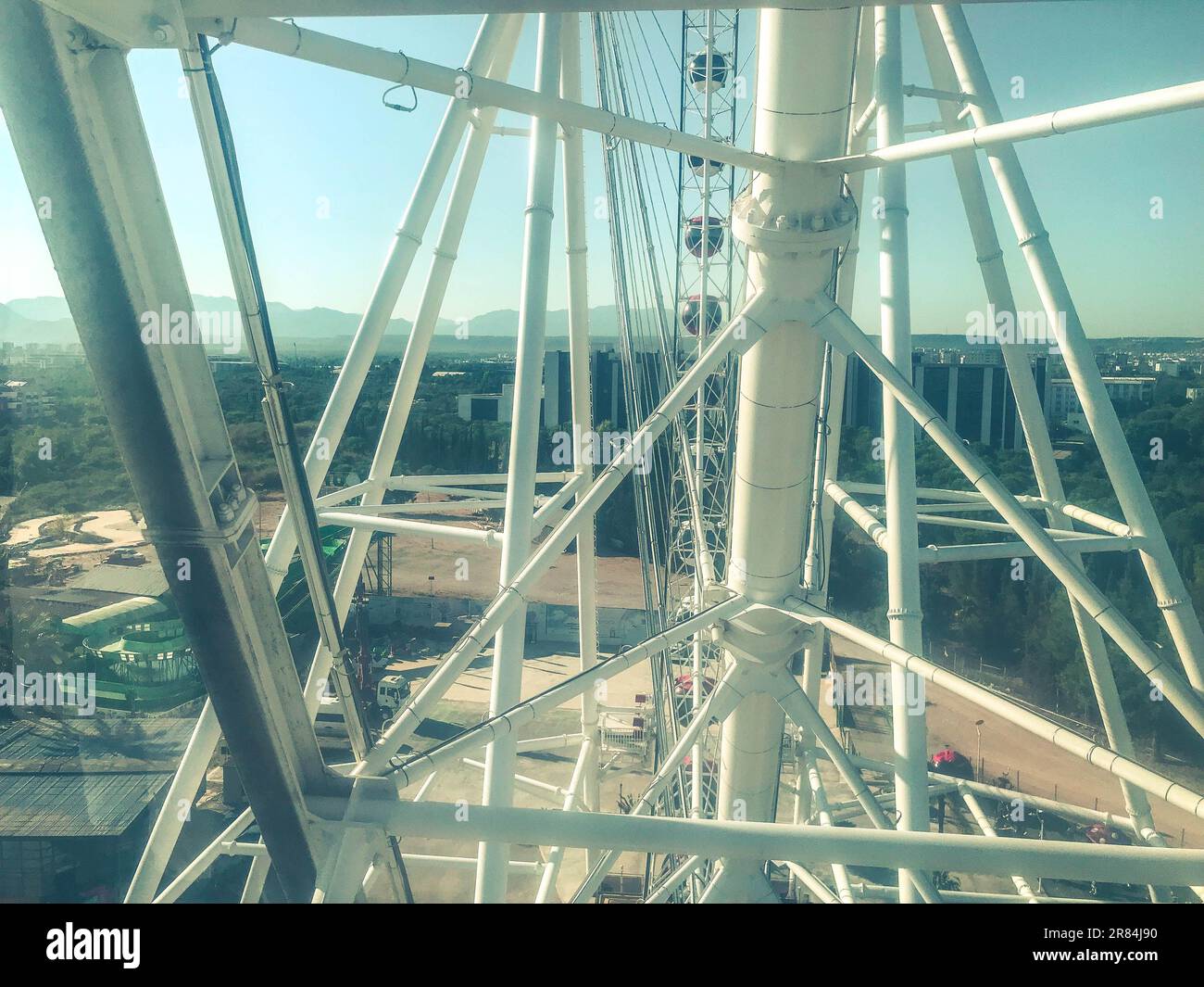 Ferris wheel. white metal beams. a huge reliable design, a carousel in ...
