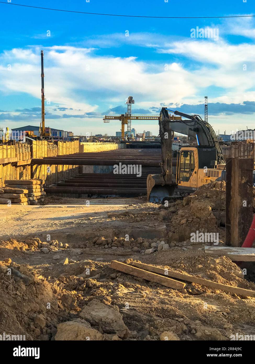 gantry crane to create a metro in the city center. the crane digs earth ...