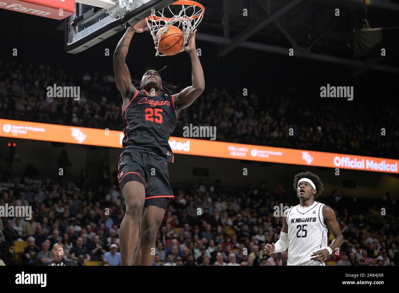FILE - Houston forward Jarace Walker, left, dunks in front of Central ...