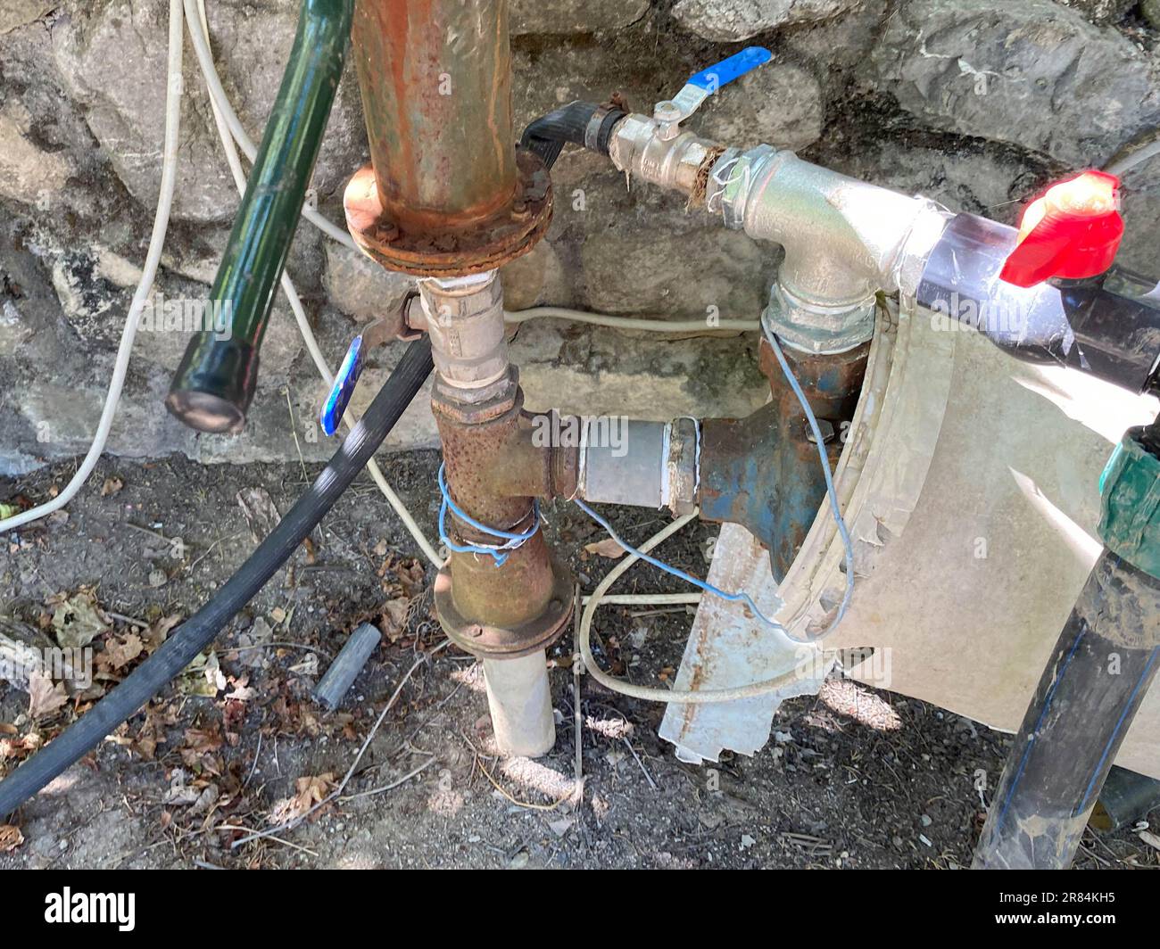 Old and greasy engine pump functioning in Burmese village Stock Photo ...