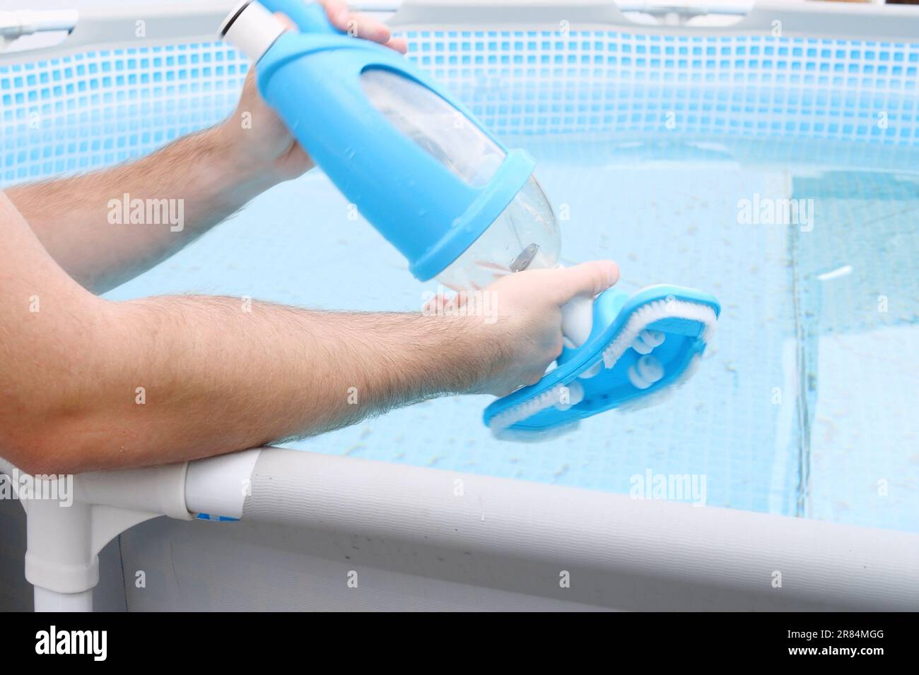 Man assembles pool vacuum cleaner hi-res stock photography and images ...