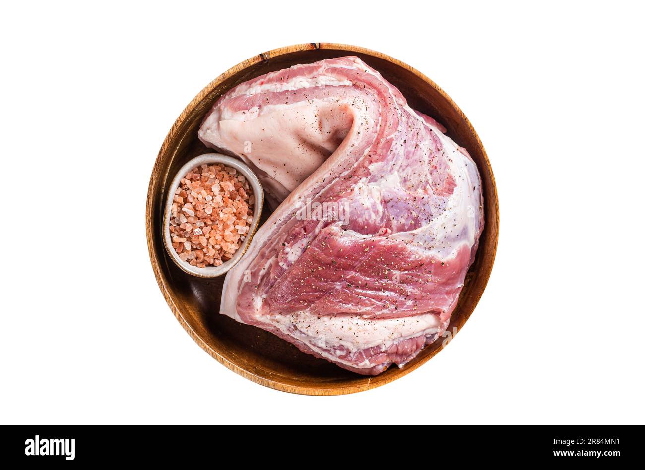 Rolled Pork belly, raw meat in a wooden plate with thyme. Isolated on ...