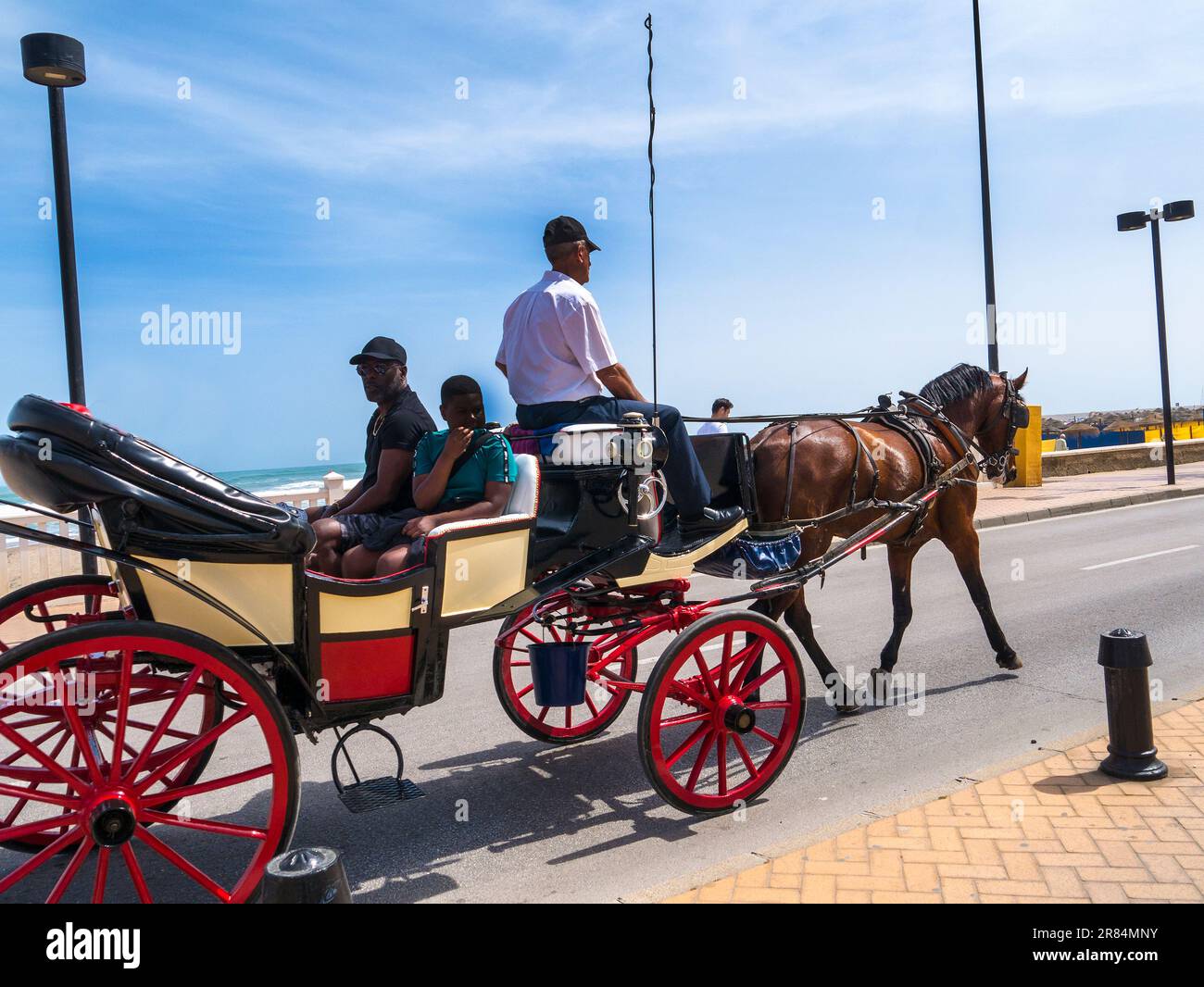 Enjoying a carriage ride down the promenade in Fuengirola on the Costa ...
