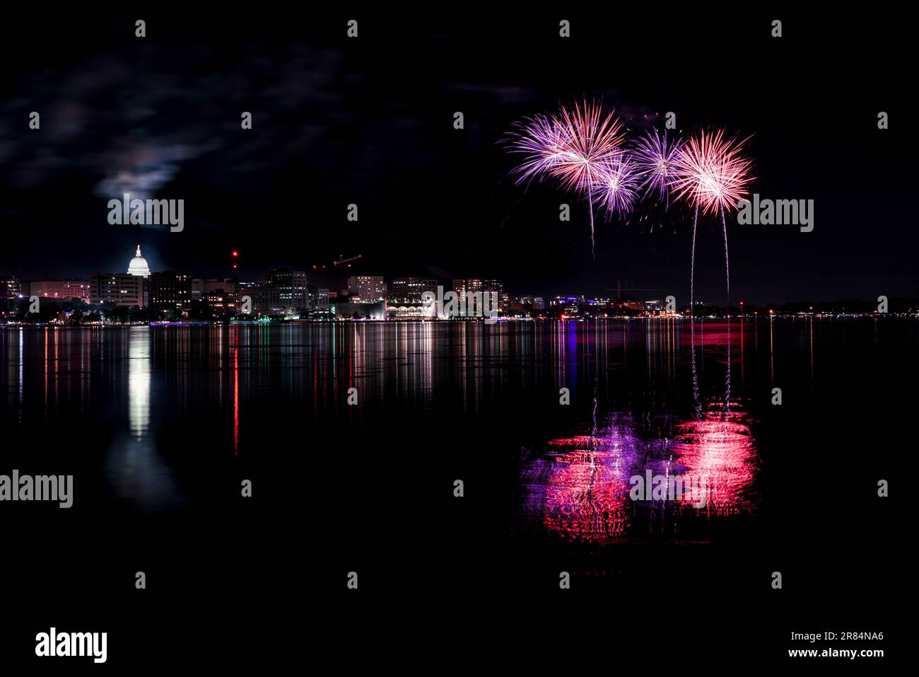 A landscape of Madison with fireworks above it at night in Wisconsin ...
